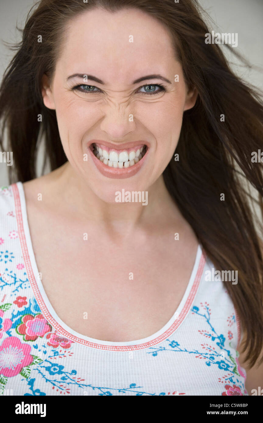 Woman clenching her teeth, close-up Stock Photo - Alamy