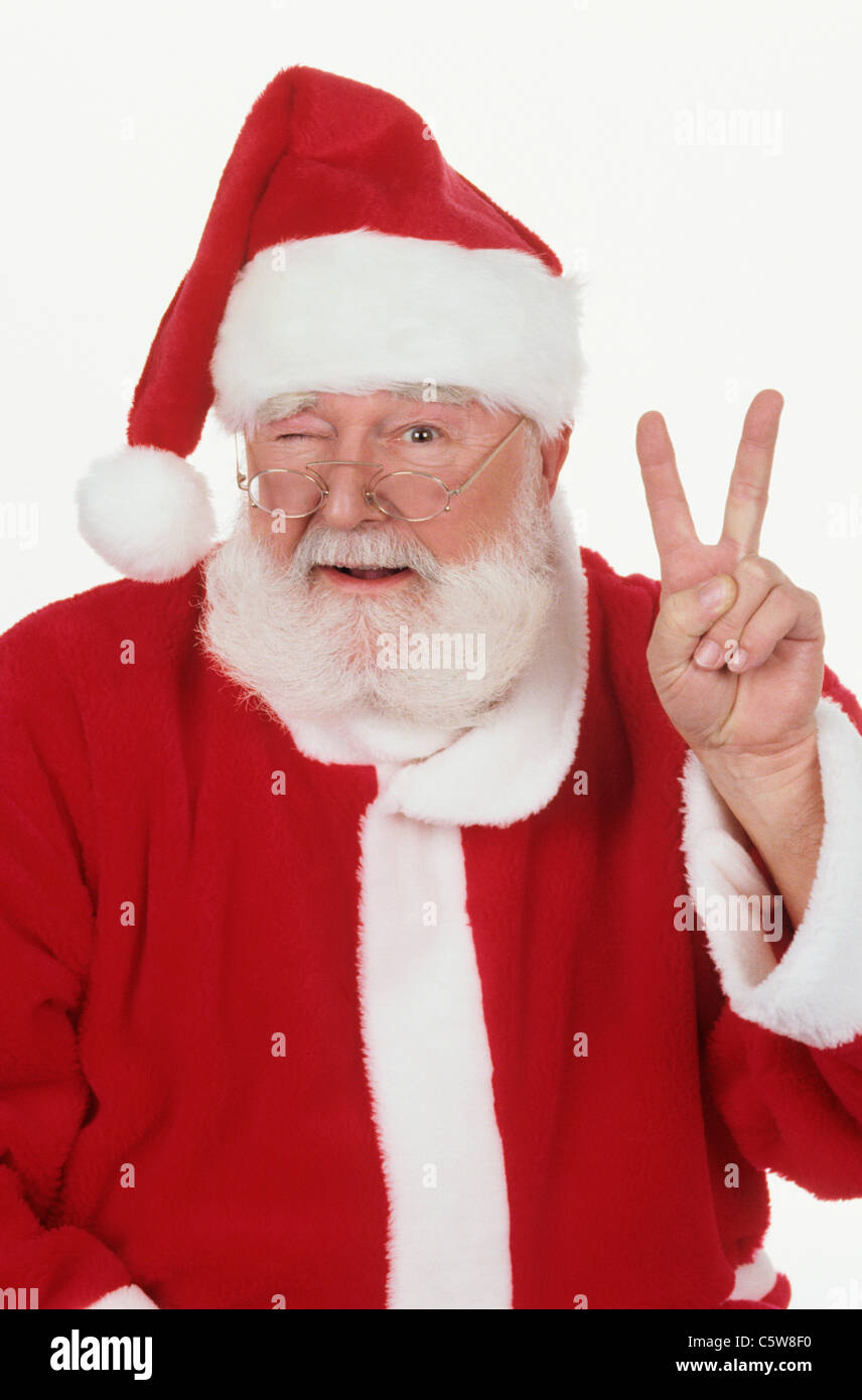 Santa Claus making peace sign, portrait Stock Photo - Alamy