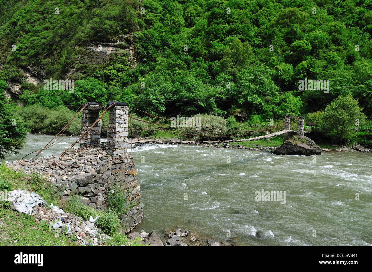 A hanging bridge over treacherous river. Sichuan, China Stock Photo - Alamy
