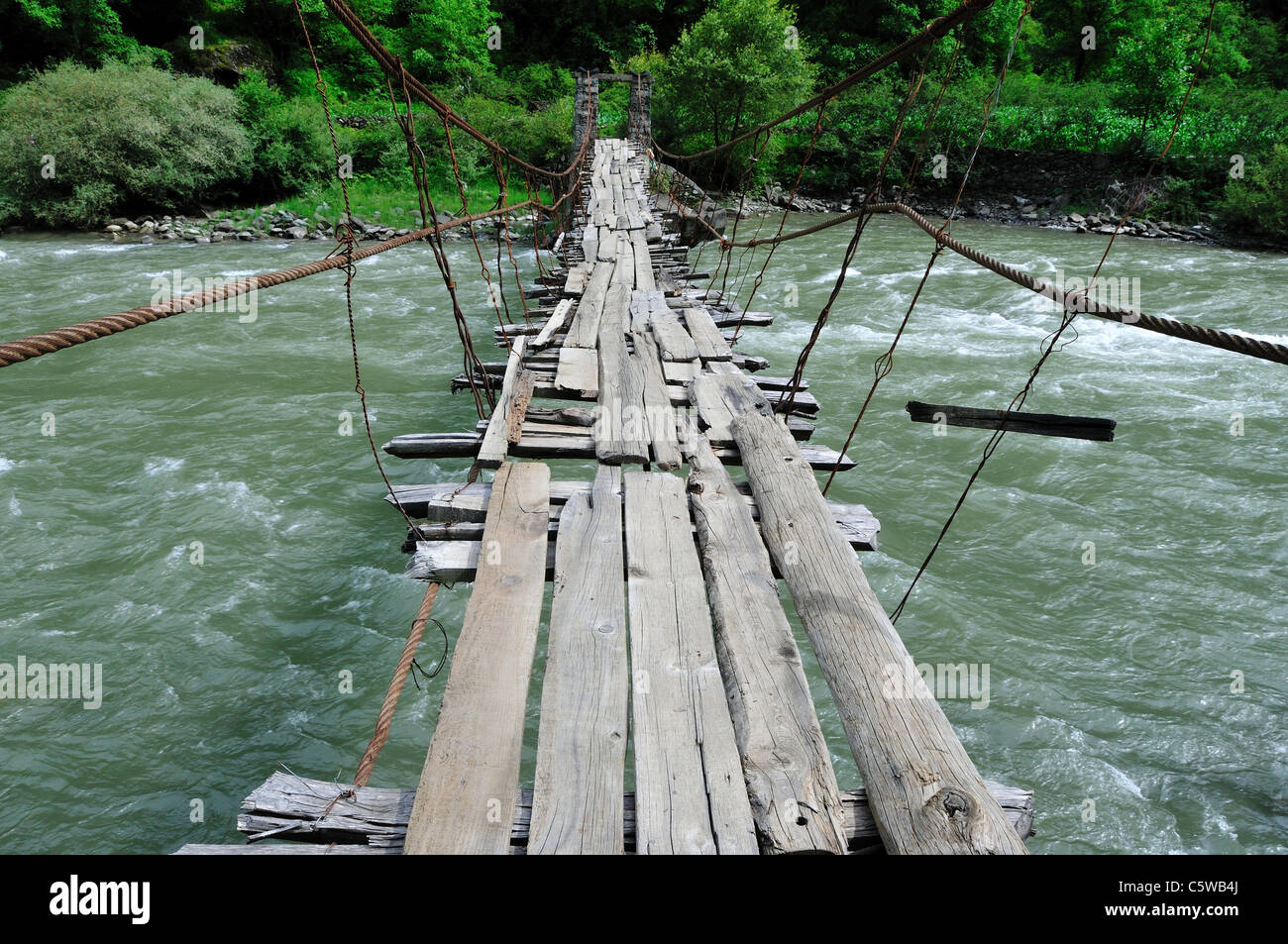 A hanging bridge over treacherous river. Sichuan, China Stock Photo - Alamy