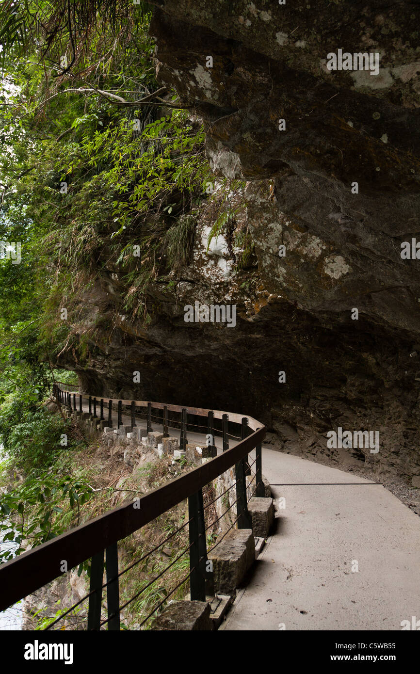 Cliffside cemented trail under rock overhang, Shakadang Trail, Taroko ...