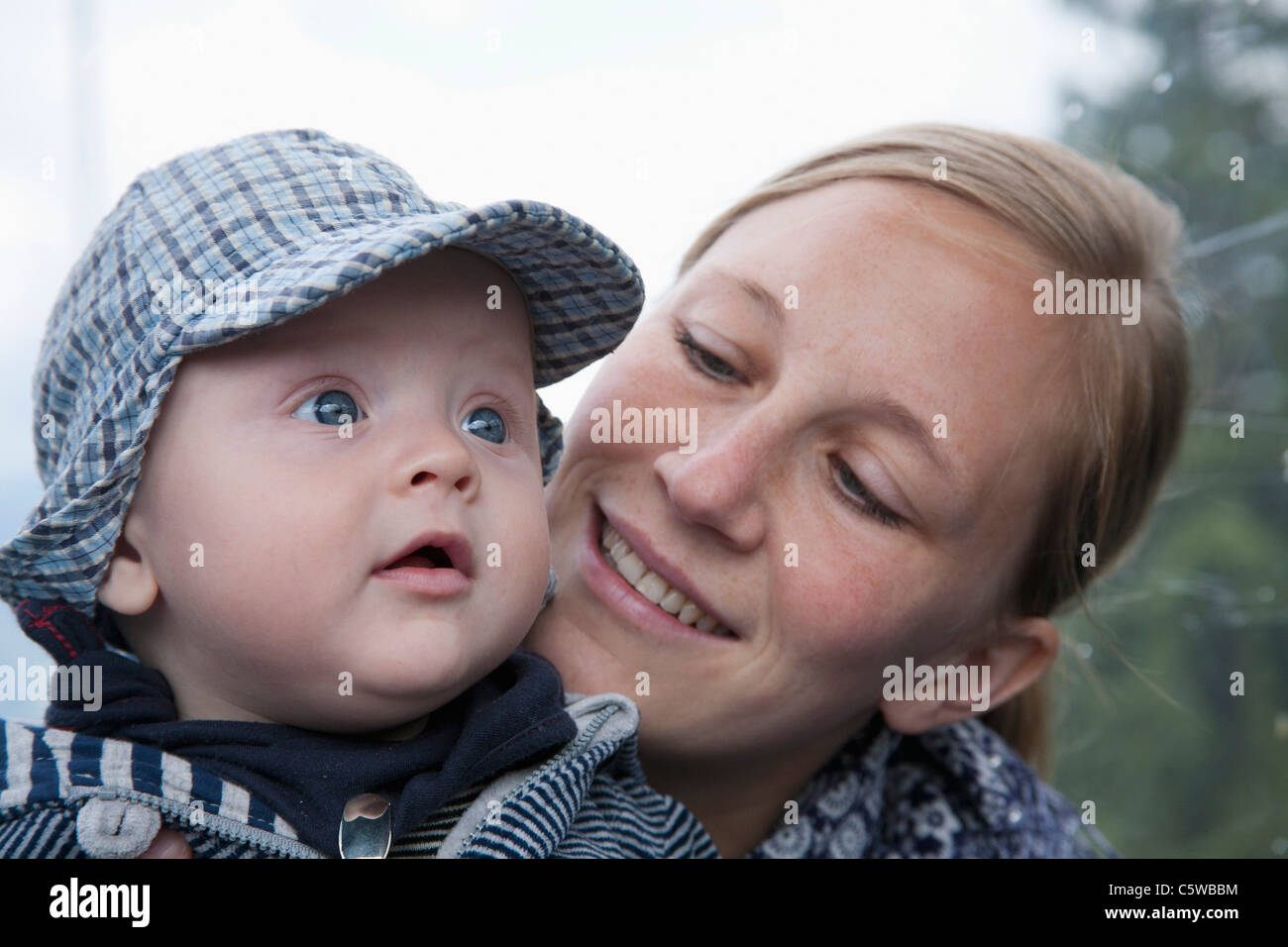 Germany, Munich, Mother with (6-11 months) baby boy, close up Stock ...
