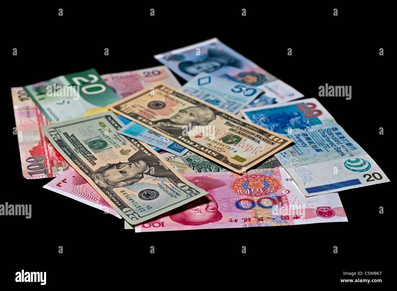 Various paper money image on black background Stock Photo - Alamy