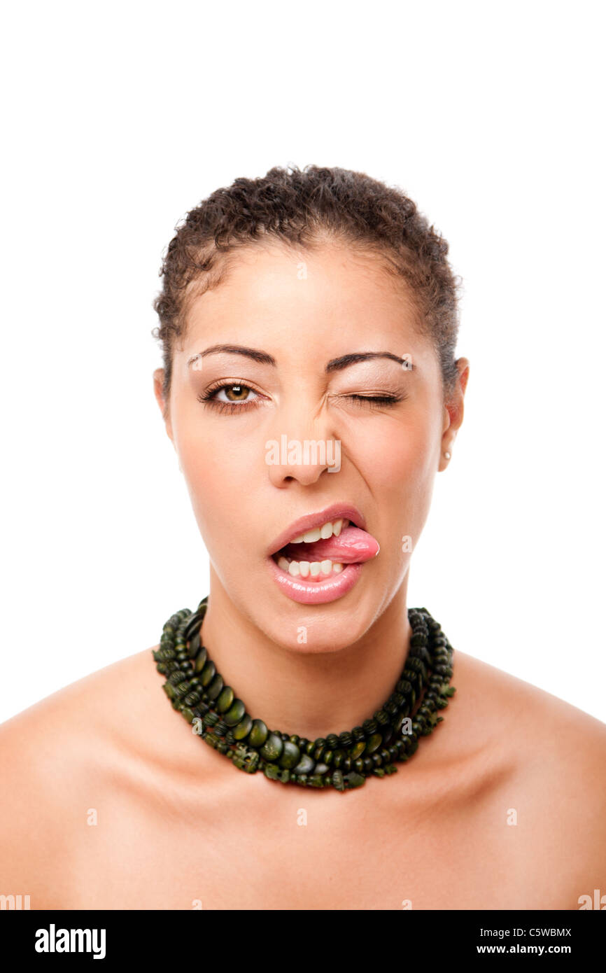 Funny Face Of A Beautiful Attractive Fashion Model Sticking Out Tongue