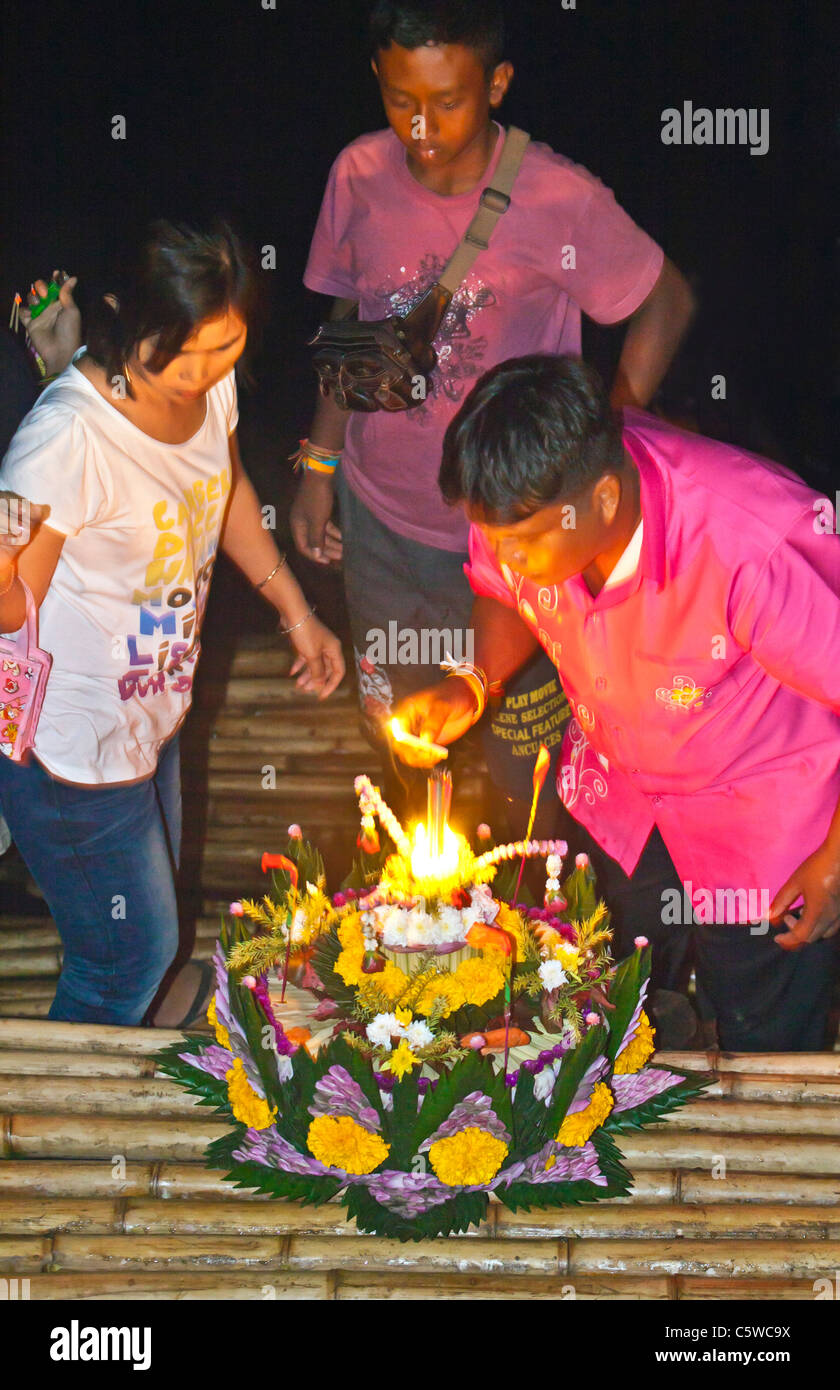 A LOI KRATHONG FLOAT is prepared for launching on a river as part of ...