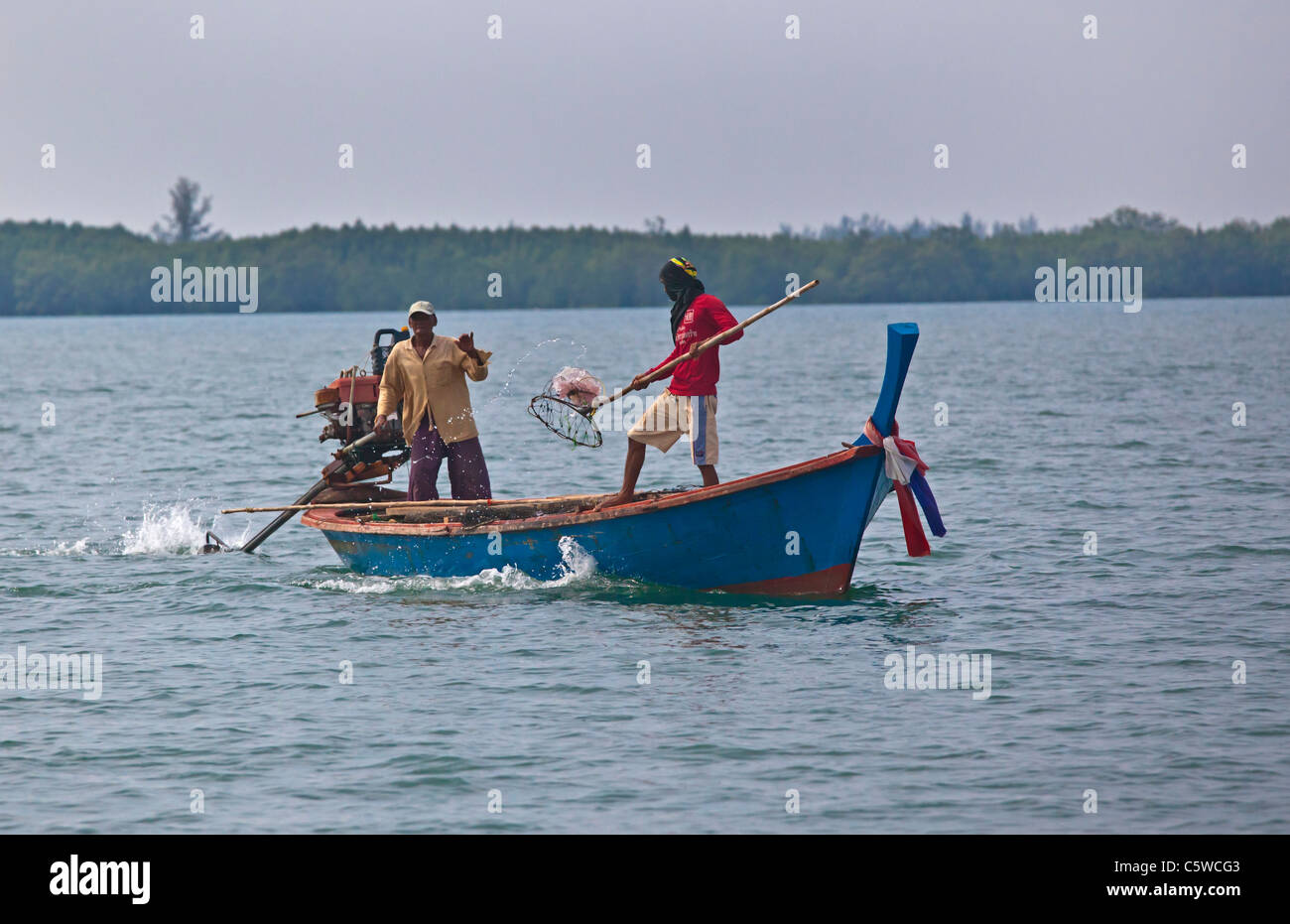 Fisherman catch jelly fish with nets off the coast of KOH PHRA THONG ...