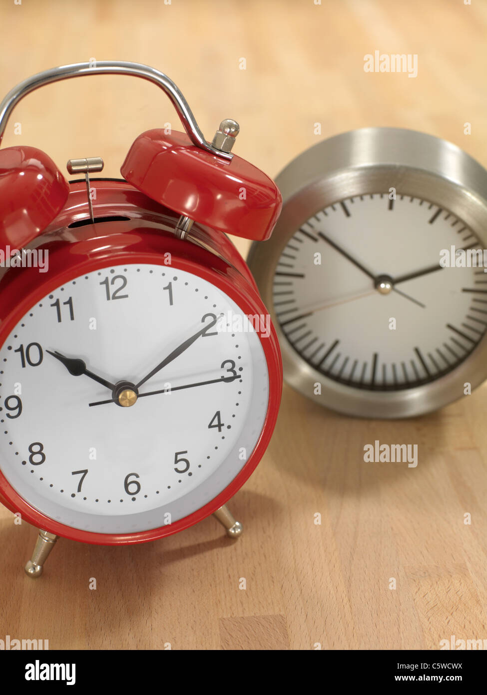 An analogue clock on a wooden bench Stock Photo - Alamy