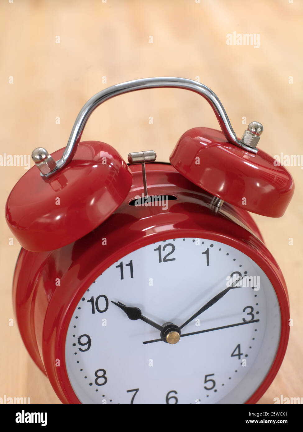 An analogue clock on a wooden bench Stock Photo - Alamy