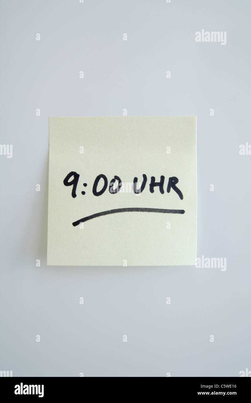Adhesive note saying "nine o'clock Stock Photo - Alamy