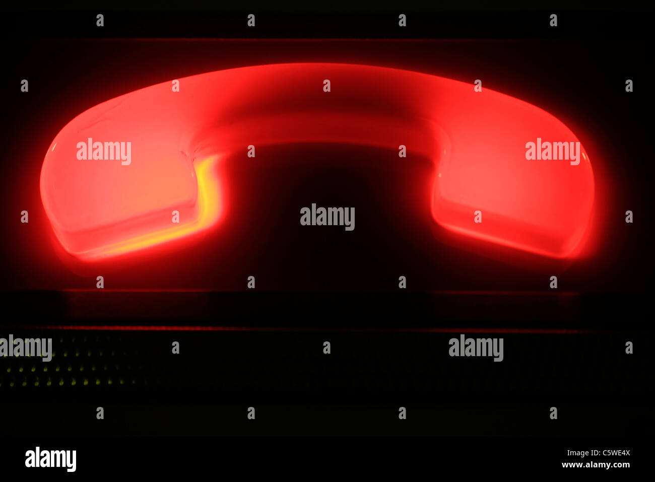 Illuminated Telephone receiver, close-up Stock Photo - Alamy