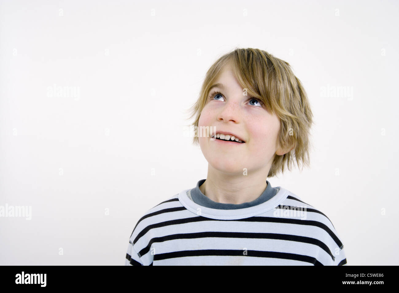 Boy looking up boy Cut Out Stock Images & Pictures - Alamy
