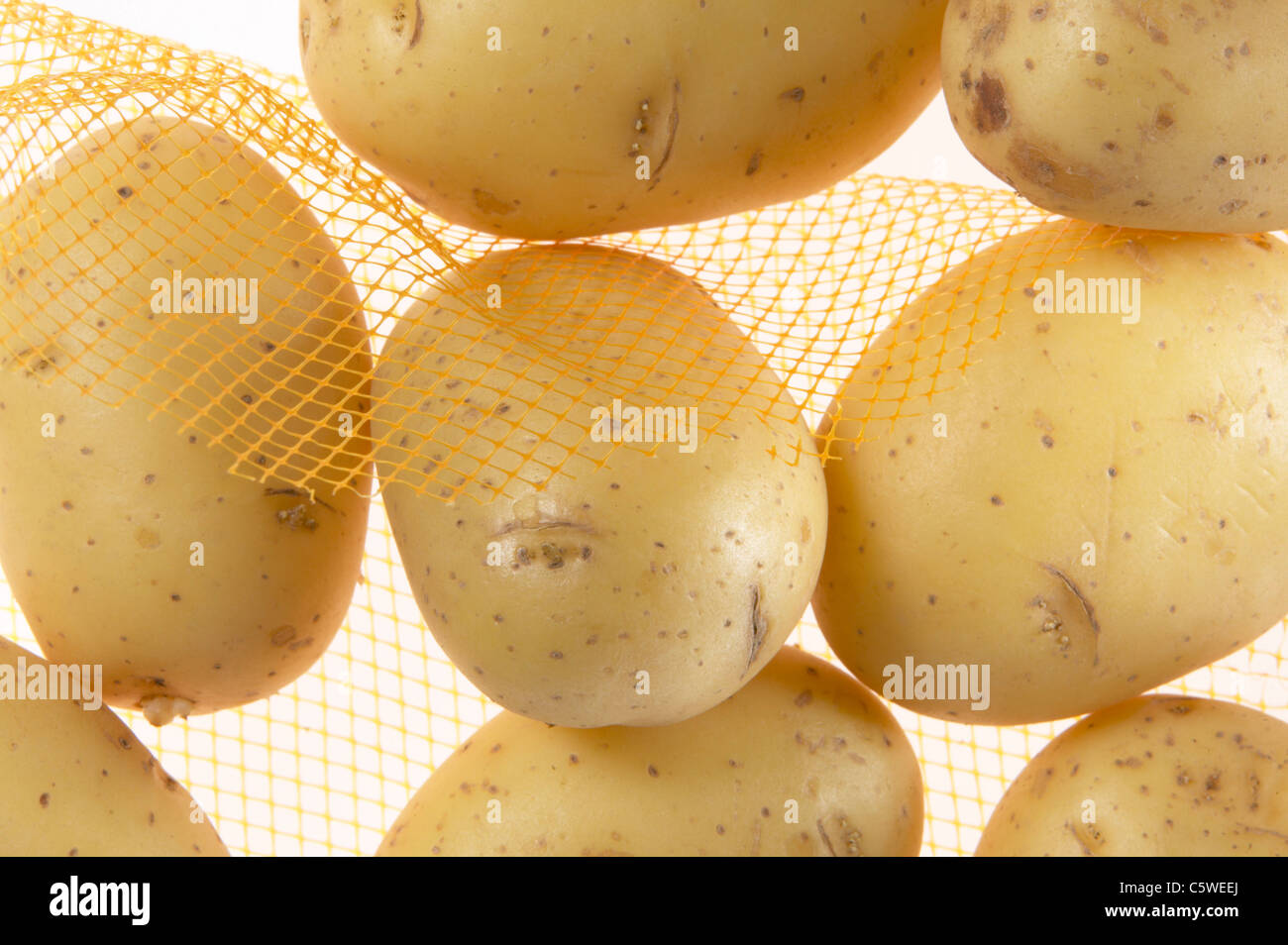 Potatoes in net, close-up Stock Photo - Alamy