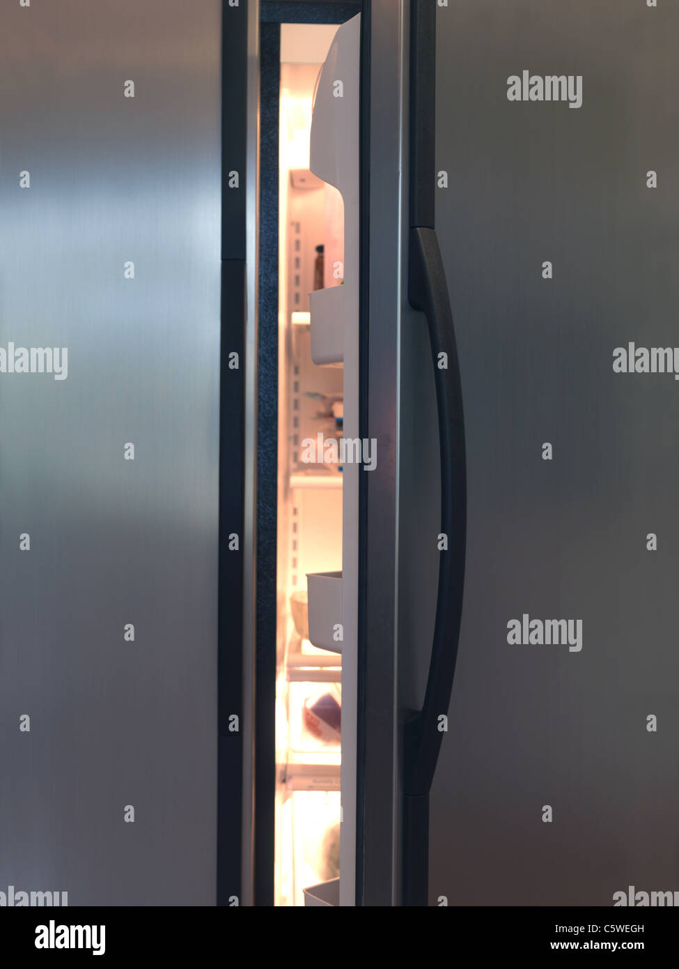 A modern duel stainless steel kitchen fridge Stock Photo - Alamy