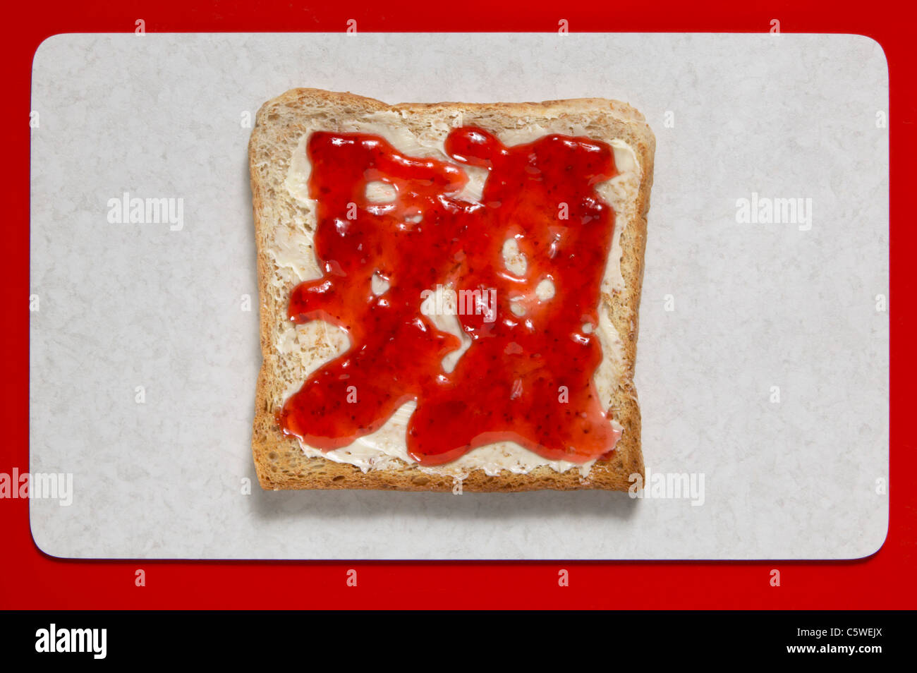 Small slice of bread spread with butter hi-res stock photography and ...