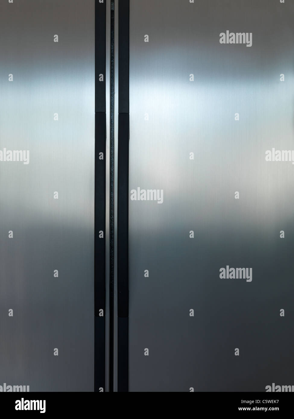 A modern duel stainless steel kitchen fridge Stock Photo - Alamy