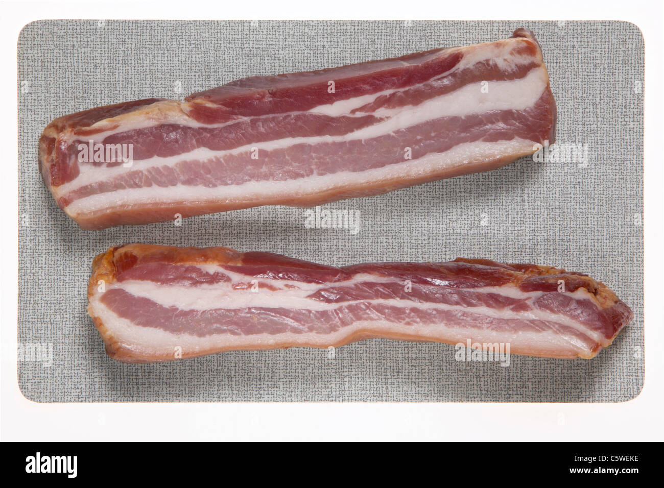 Raw bacon, elevated view Stock Photo - Alamy
