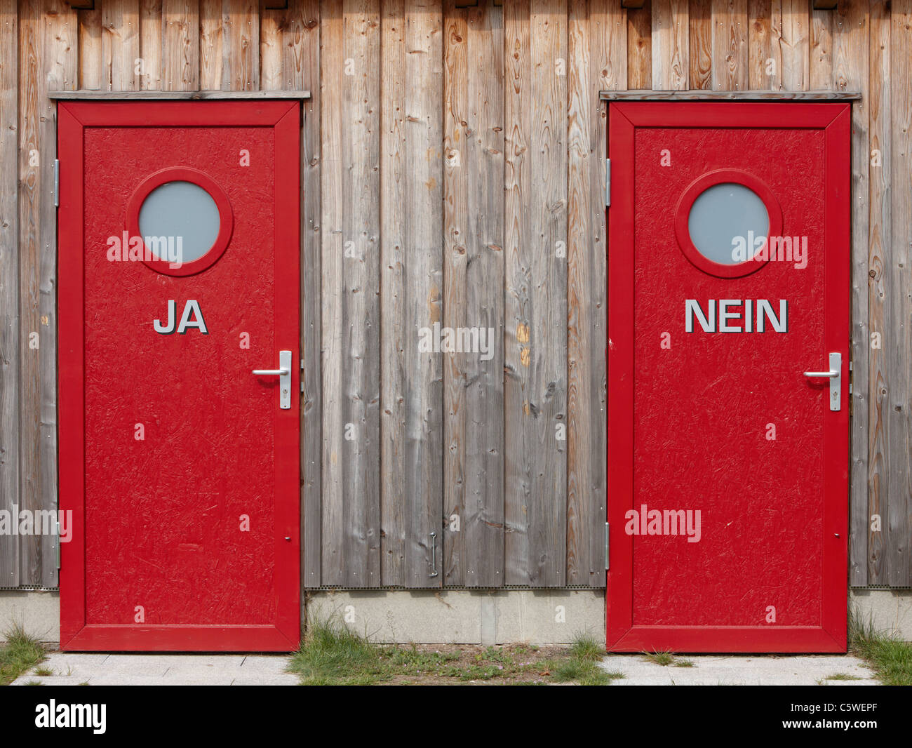 Two red doors, close-up Stock Photo - Alamy