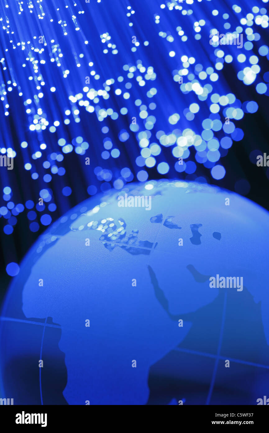 Blurred blue fiber light with blue glass globe Stock Photo - Alamy