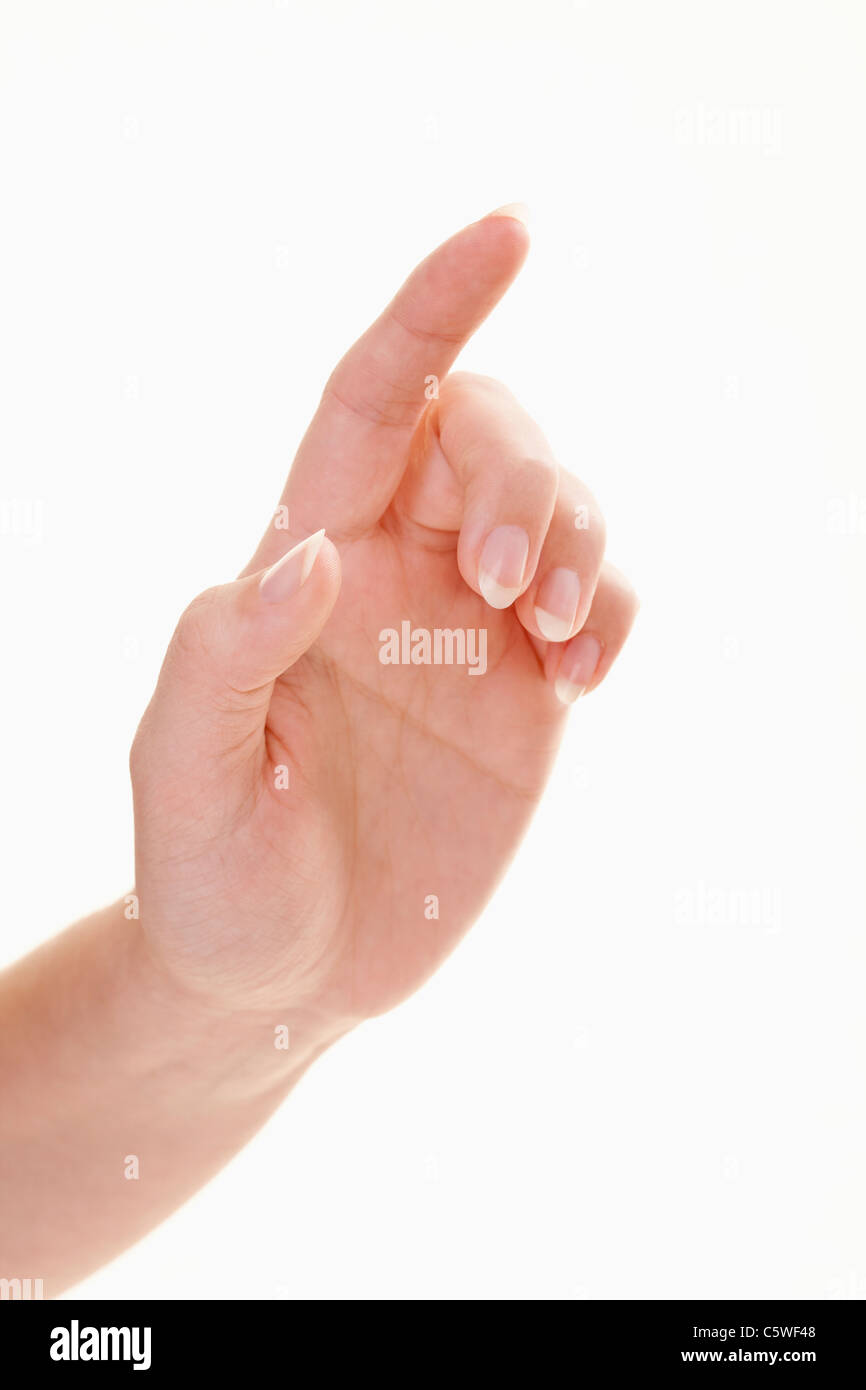 Hand of woman pointing against white background, close up Stock Photo ...