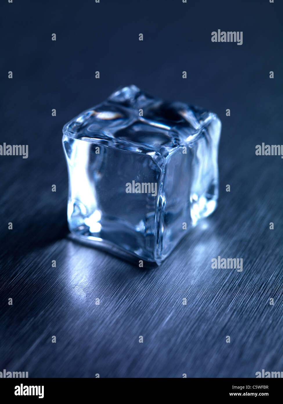 Frozen ice cubes isolated on a kitchen bench Stock Photo - Alamy