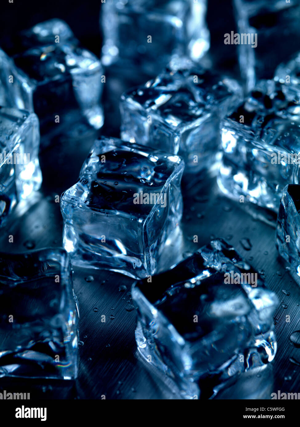 Frozen ice cubes isolated on a kitchen bench Stock Photo - Alamy