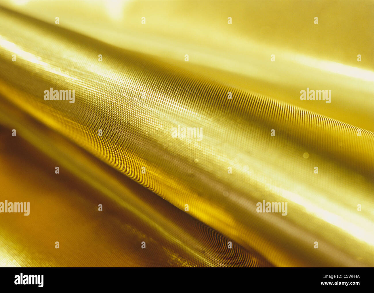 Background of gold fabric, close up Stock Photo - Alamy
