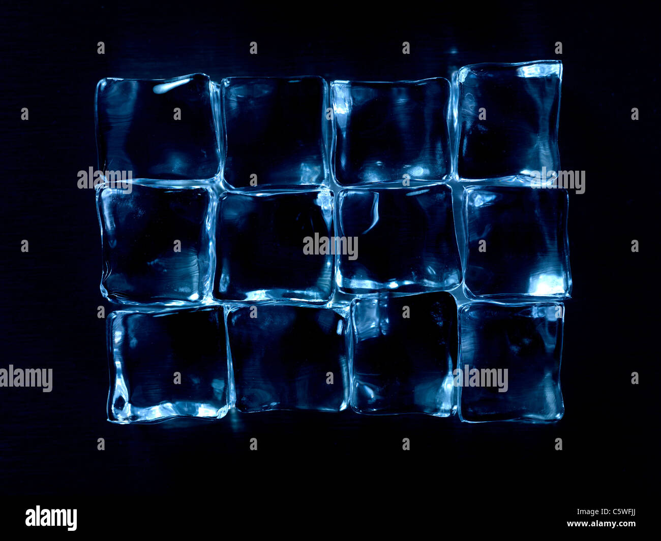 Frozen ice cubes isolated on a kitchen bench Stock Photo - Alamy