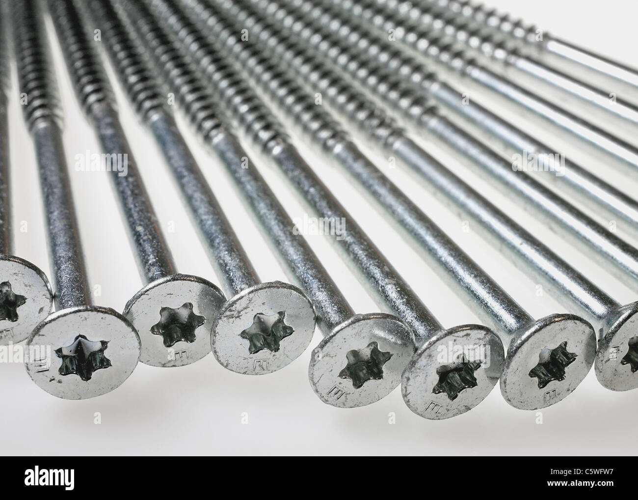 Screws on white background Stock Photo - Alamy