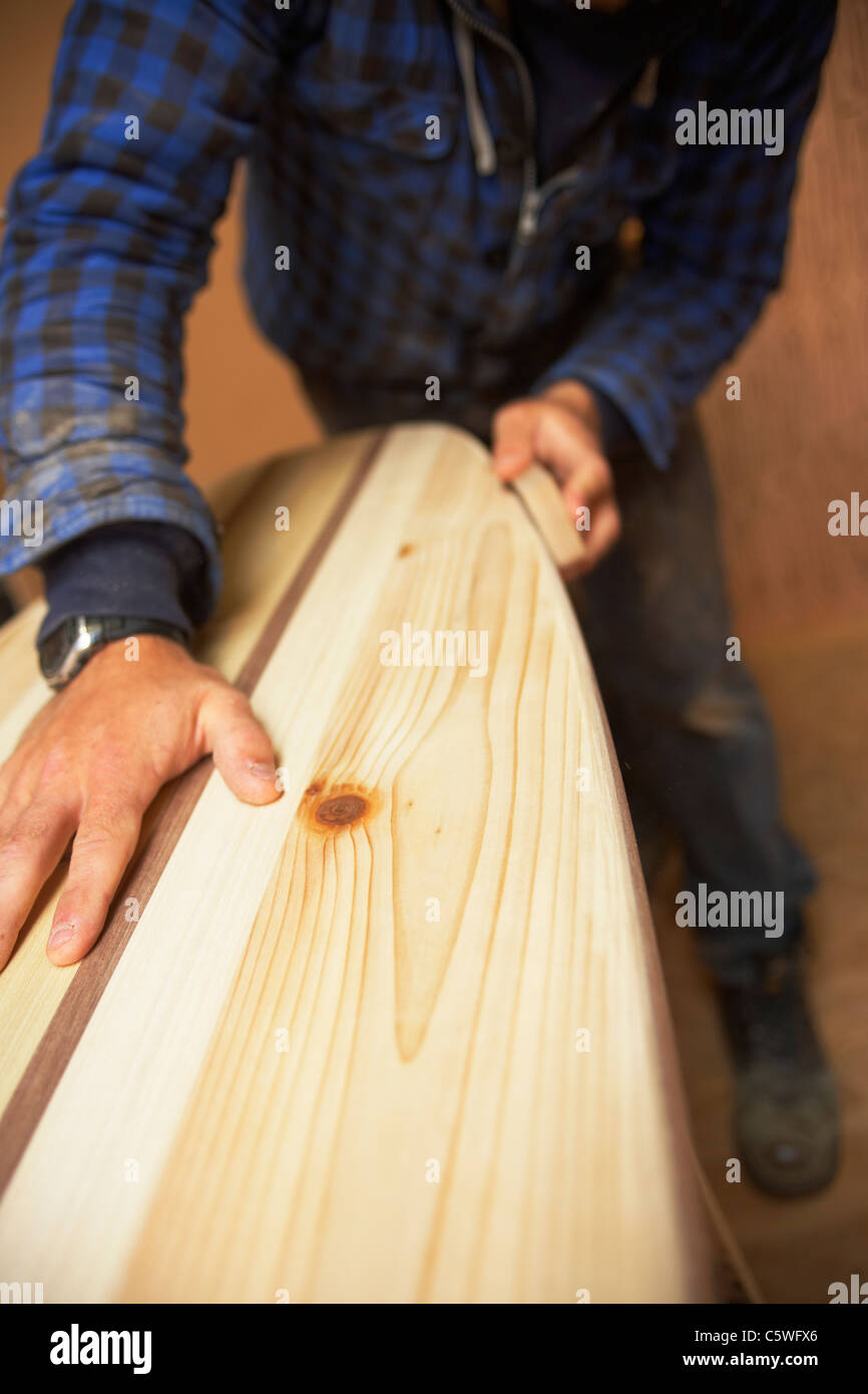 James Otter working on surfboard Stock Photo - Alamy