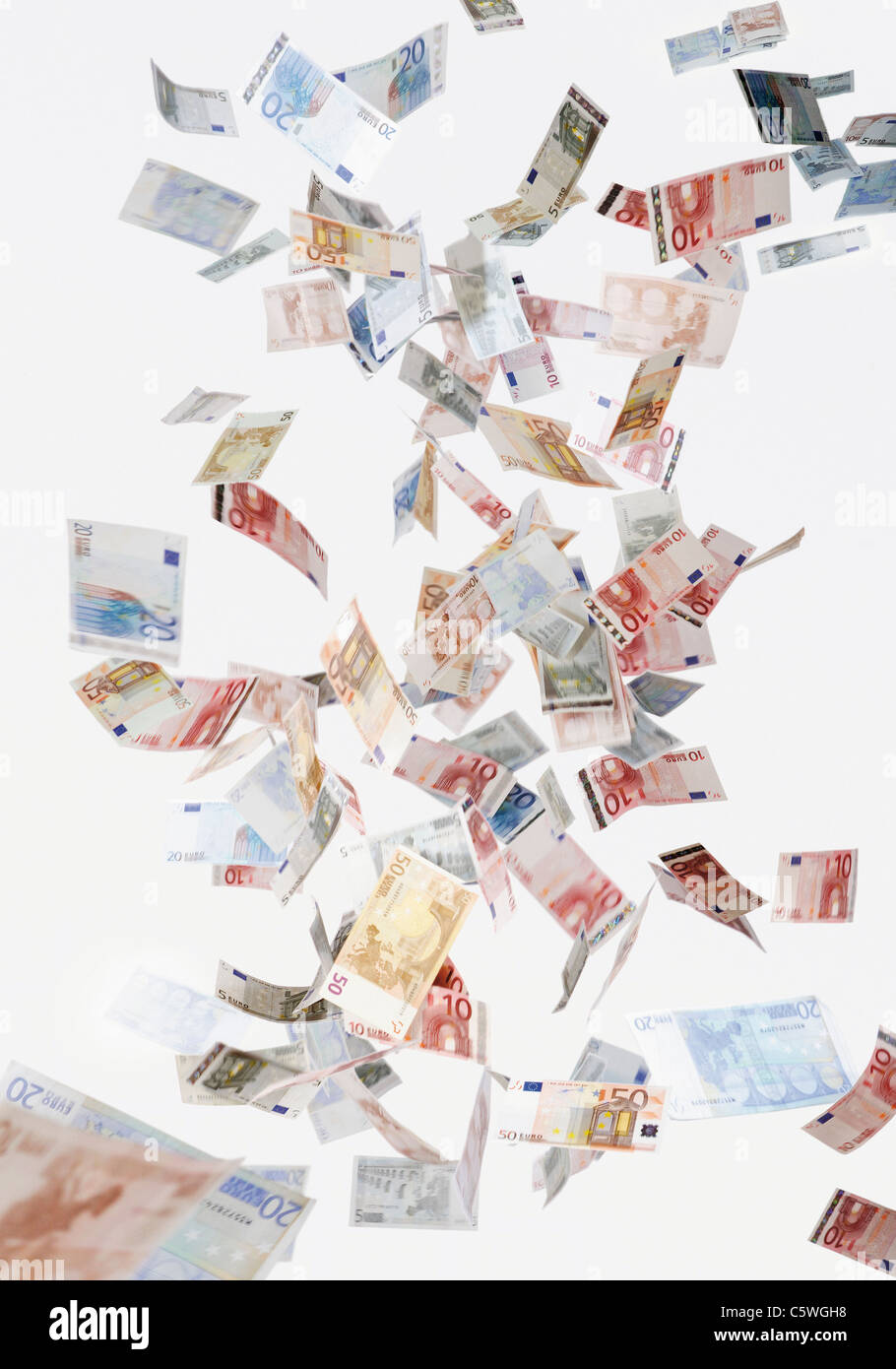 Variety of falling euro notes against white background Stock Photo - Alamy