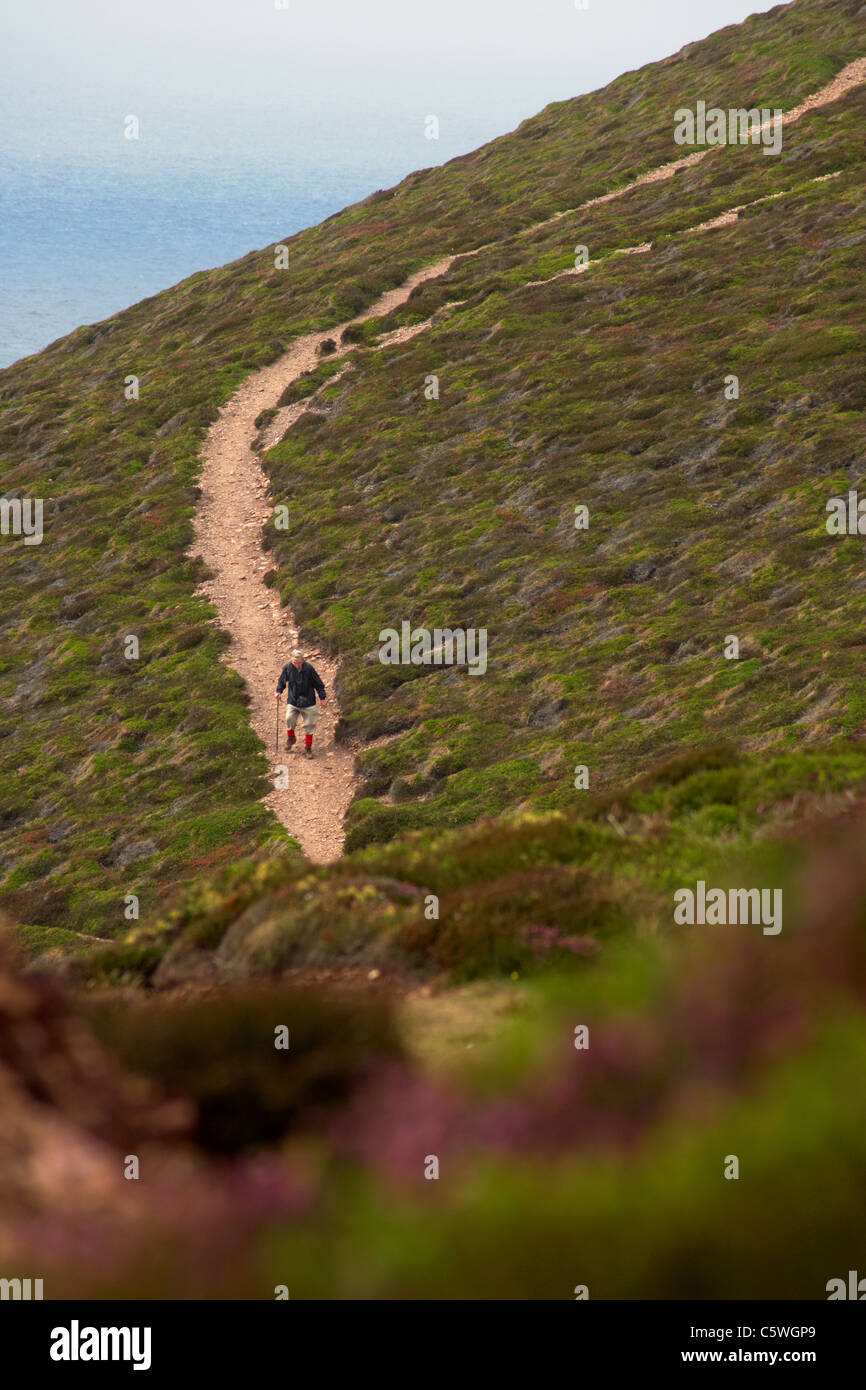 Rambler walking along the Southwest coastpath at Wheal Coates St Agnes ...