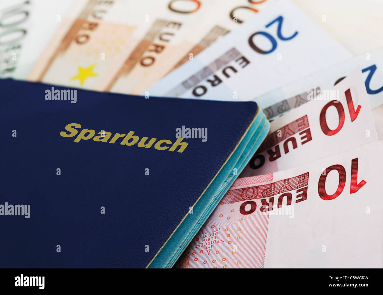 Close up of bank book on fanned euro notes Stock Photo - Alamy