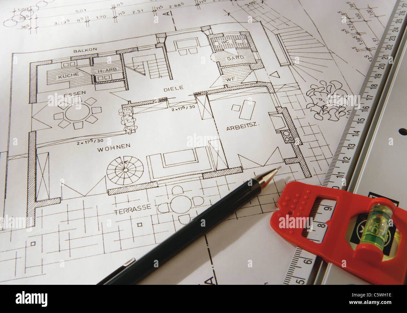 Blueprint with pen and tape measure, close up Stock Photo - Alamy