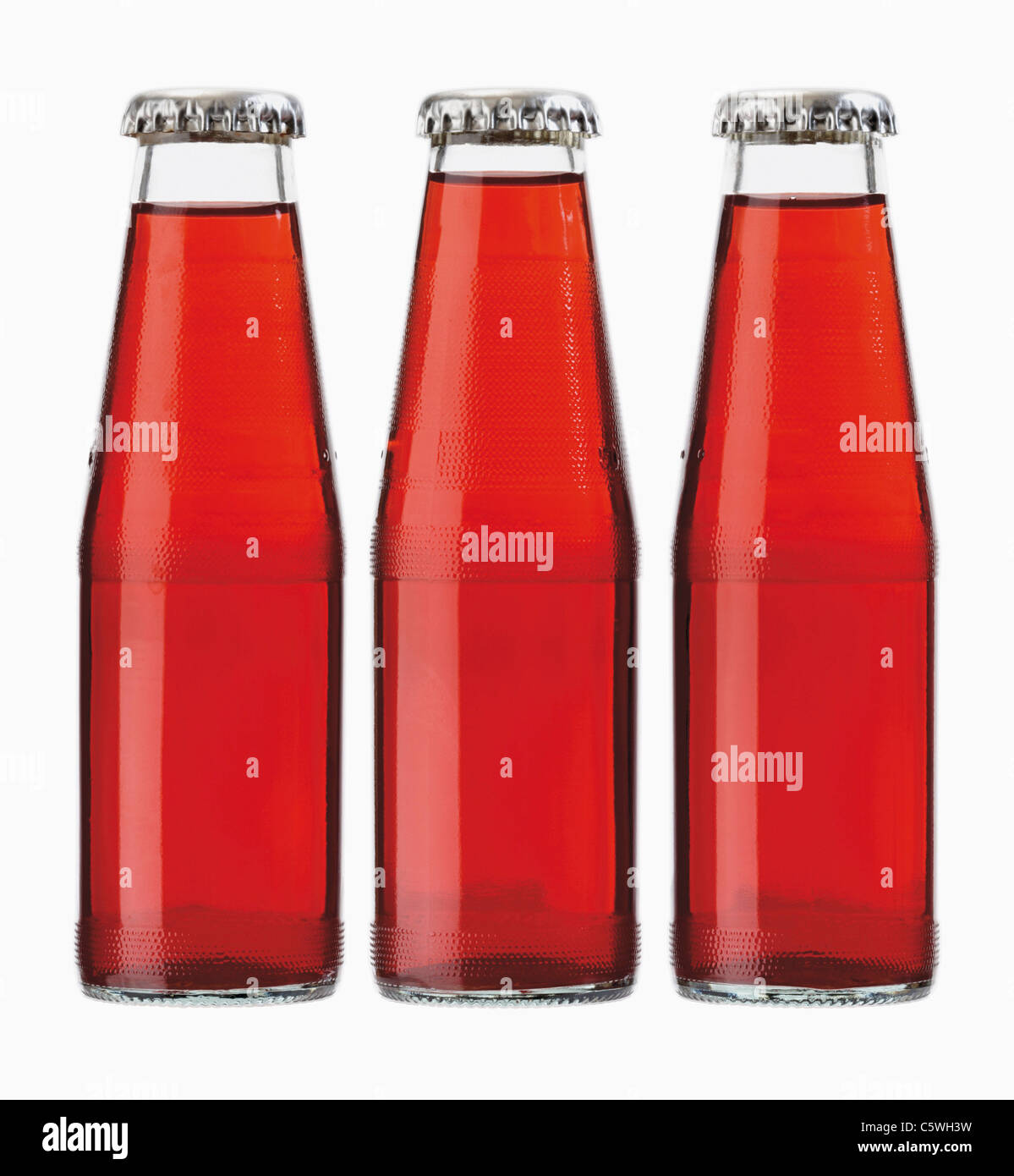 Three red juice bottles against white background, close up Stock Photo ...