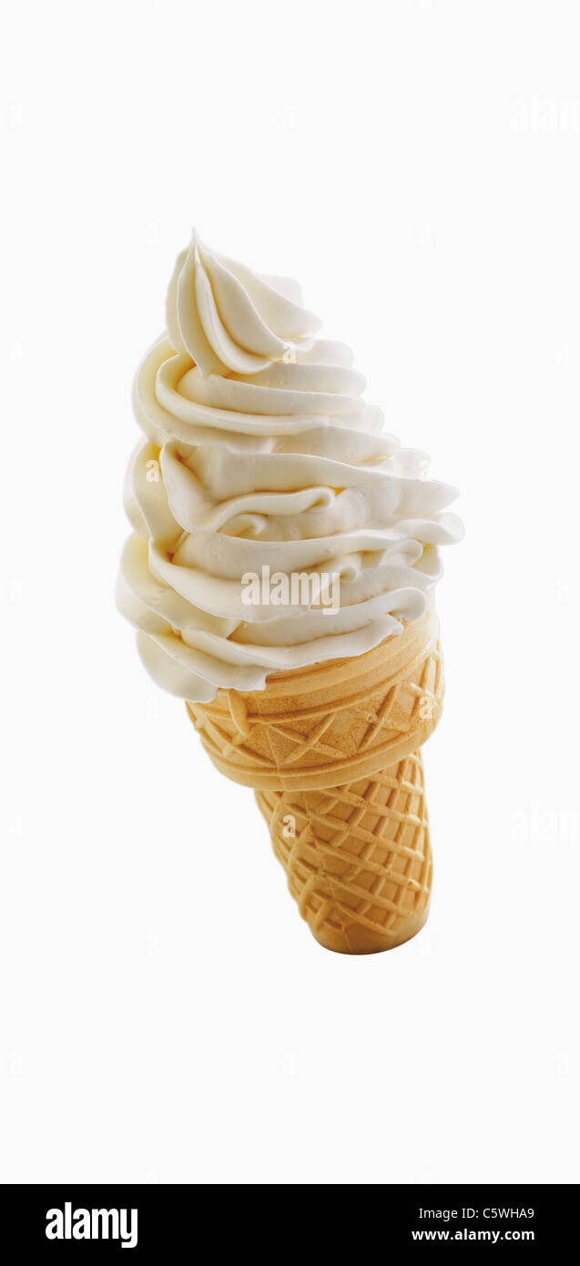 Vanilla ice cream cone against white background Stock Photo - Alamy