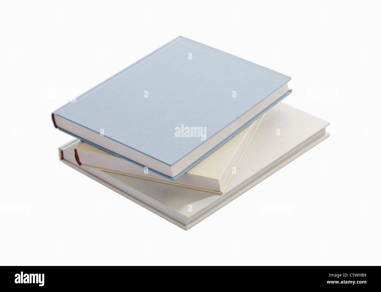 Stack of three books against white background, close-up Stock Photo - Alamy