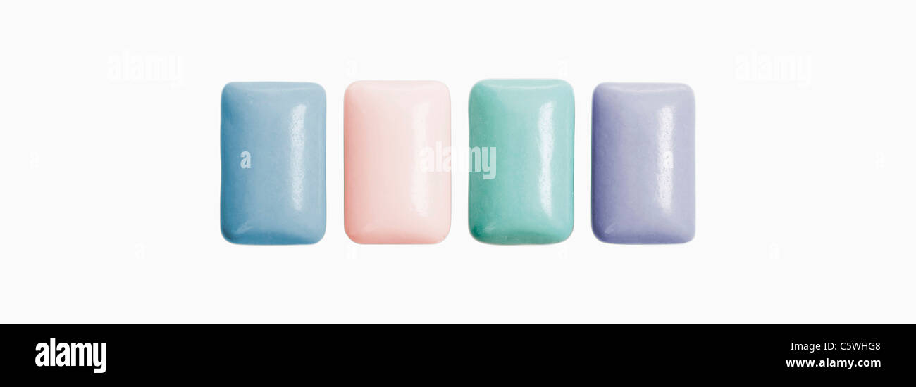 Four chewing gum tablets against white background, close up Stock Photo ...