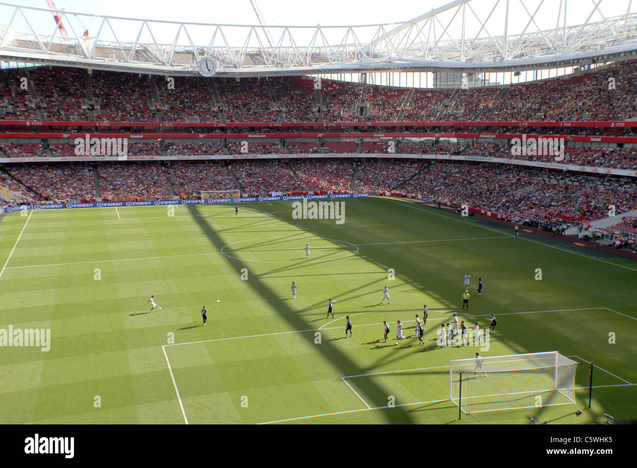 UK. Football crowds watch Arsenal play at the Emirates stadium in ...
