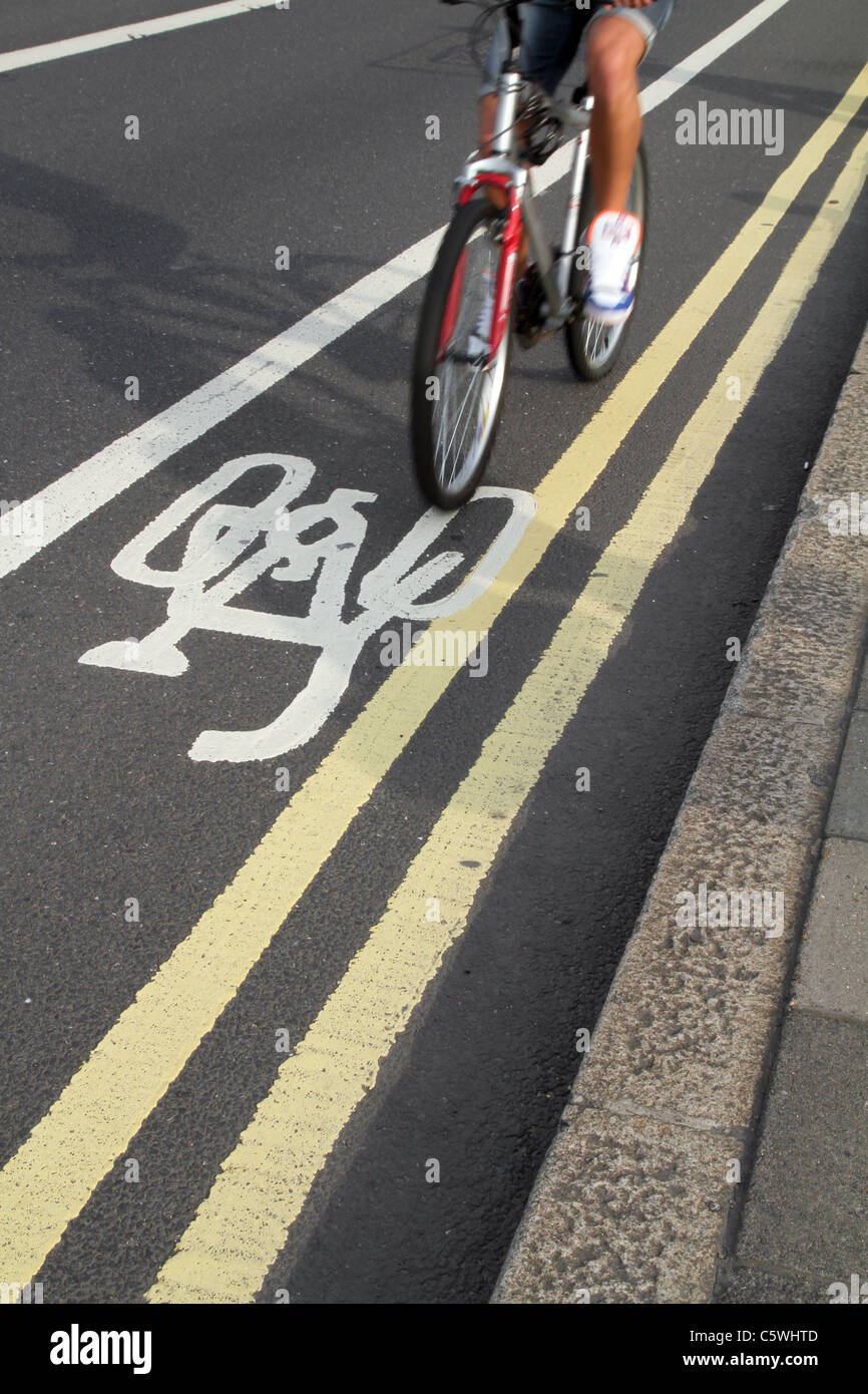 UK. Cyclist on a cycle lane in London Stock Photo - Alamy