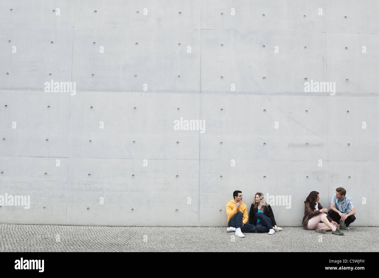 Berlin wall people talking hi-res stock photography and images - Alamy