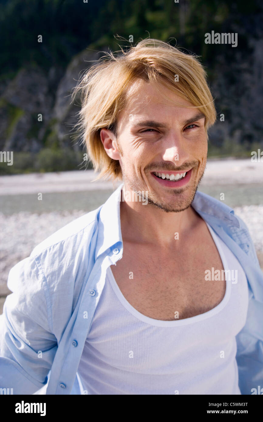 Germany, Bavaria, Young man smiling, portrait Stock Photo - Alamy