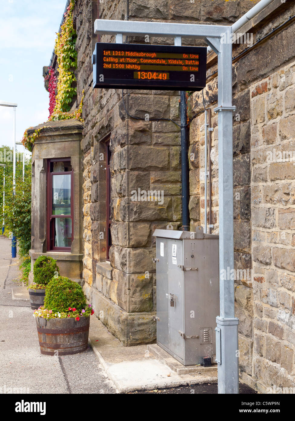 Modern high tech electronic train time indicator on a small rural ...