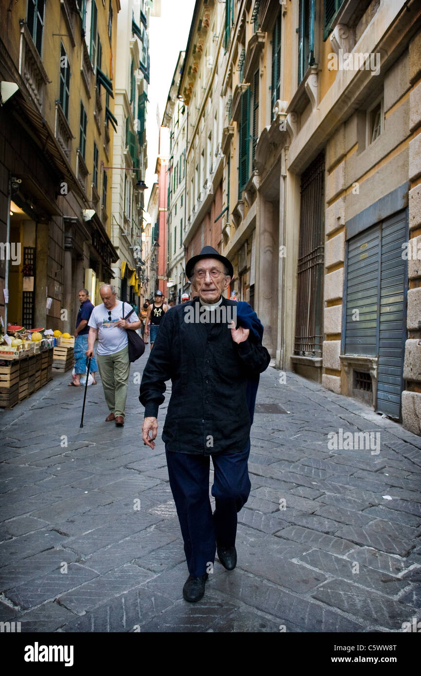 Don Andrea Gallo walks in caruggi, Genoa, Italy Stock Photo - Alamy