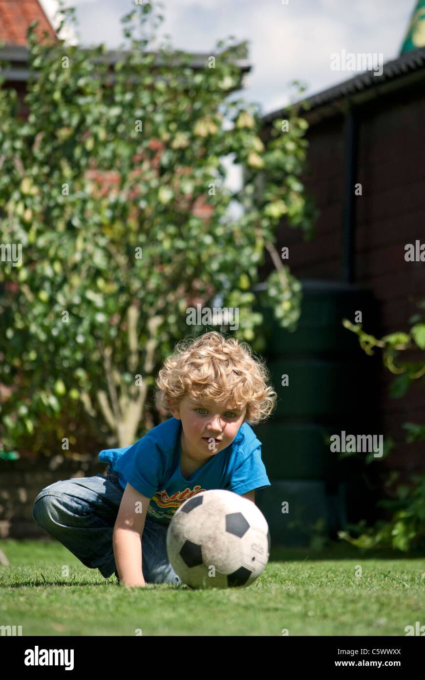 6 year old playing football hi-res stock photography and images - Alamy