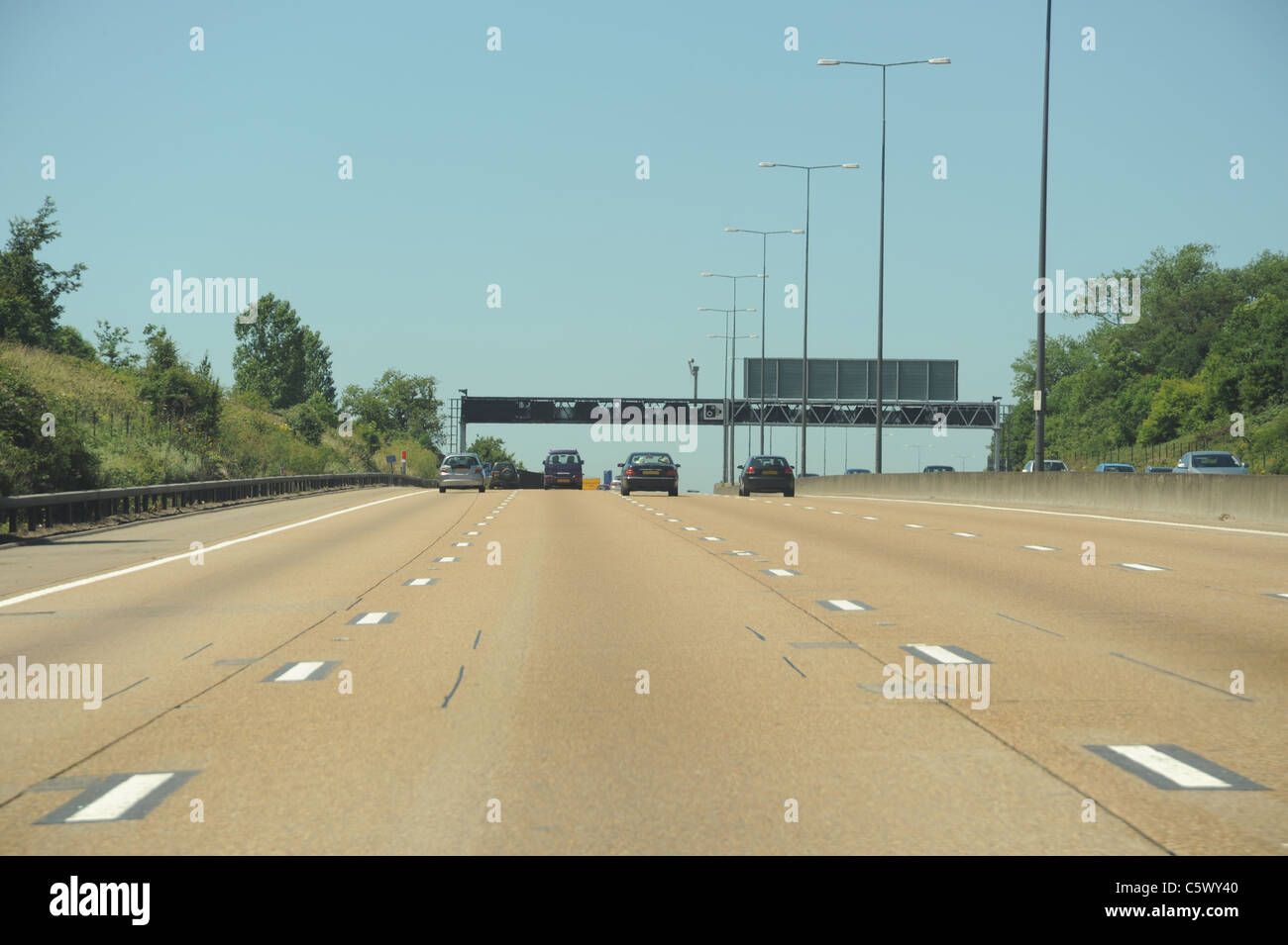 Photograph of a motorway with cars in the distance Stock Photo - Alamy