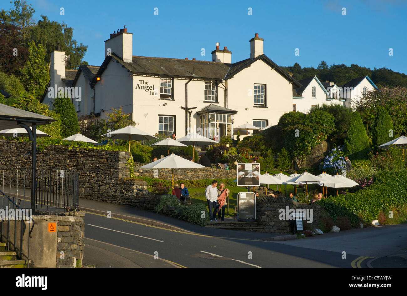 Drinkers sitting in the beer garden of the Angel Inn, Bowness-on ...