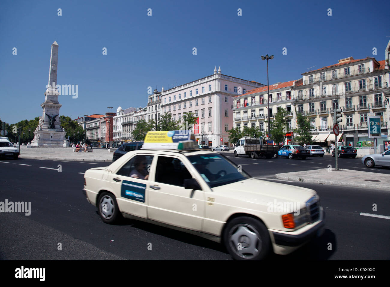 A taxi speeding along Praça dos Restauradores (Restauradores Square) on ...