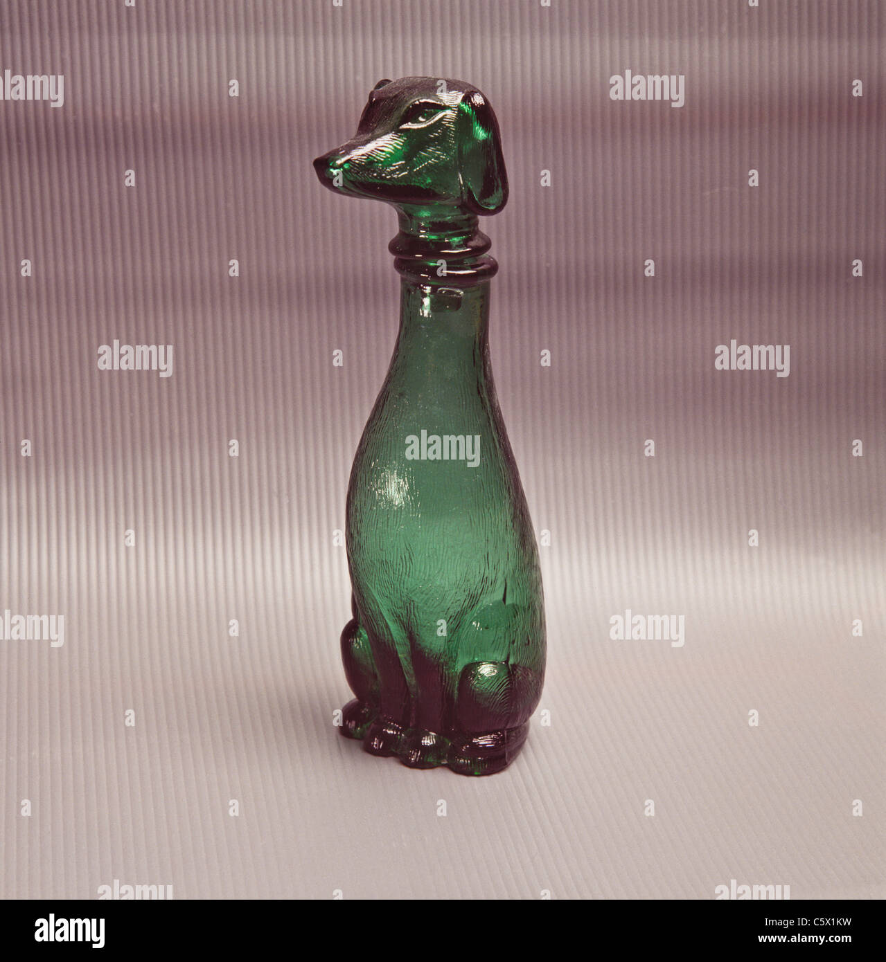 Clear green glass dog shaped decanter Stock Photo - Alamy