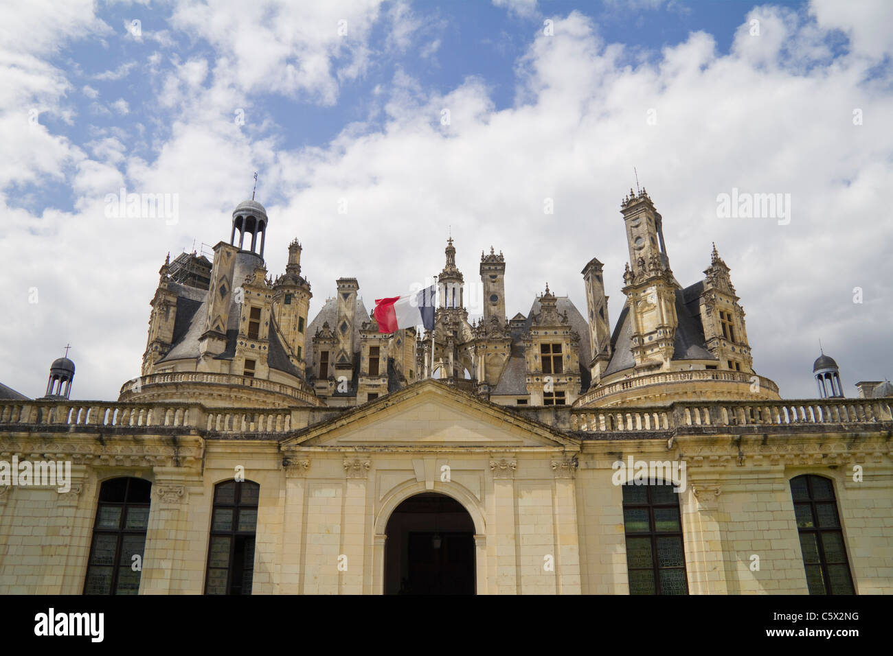 Turrets windows and French flag Loire castle, Chateau de Chambord ...