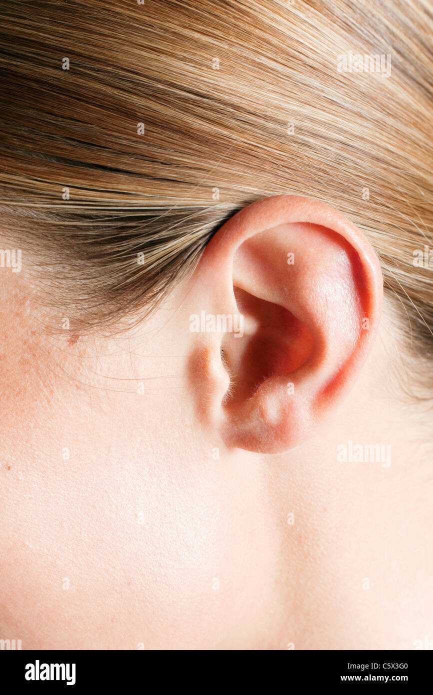 Woman's ear, full frame, close-up Stock Photo - Alamy
